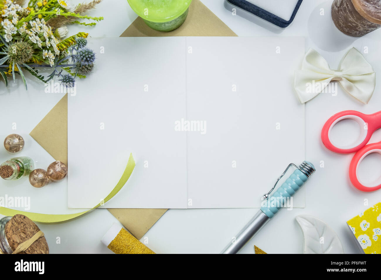 Flat lay of open postcard with empty space for slogan or invitation for ...