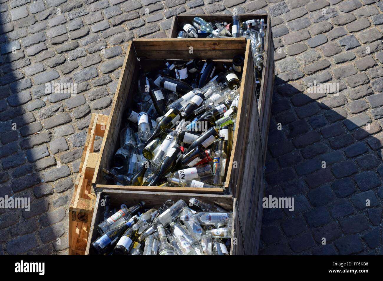 Recycling Bin with Glass Bottles Stock Photo - Alamy
