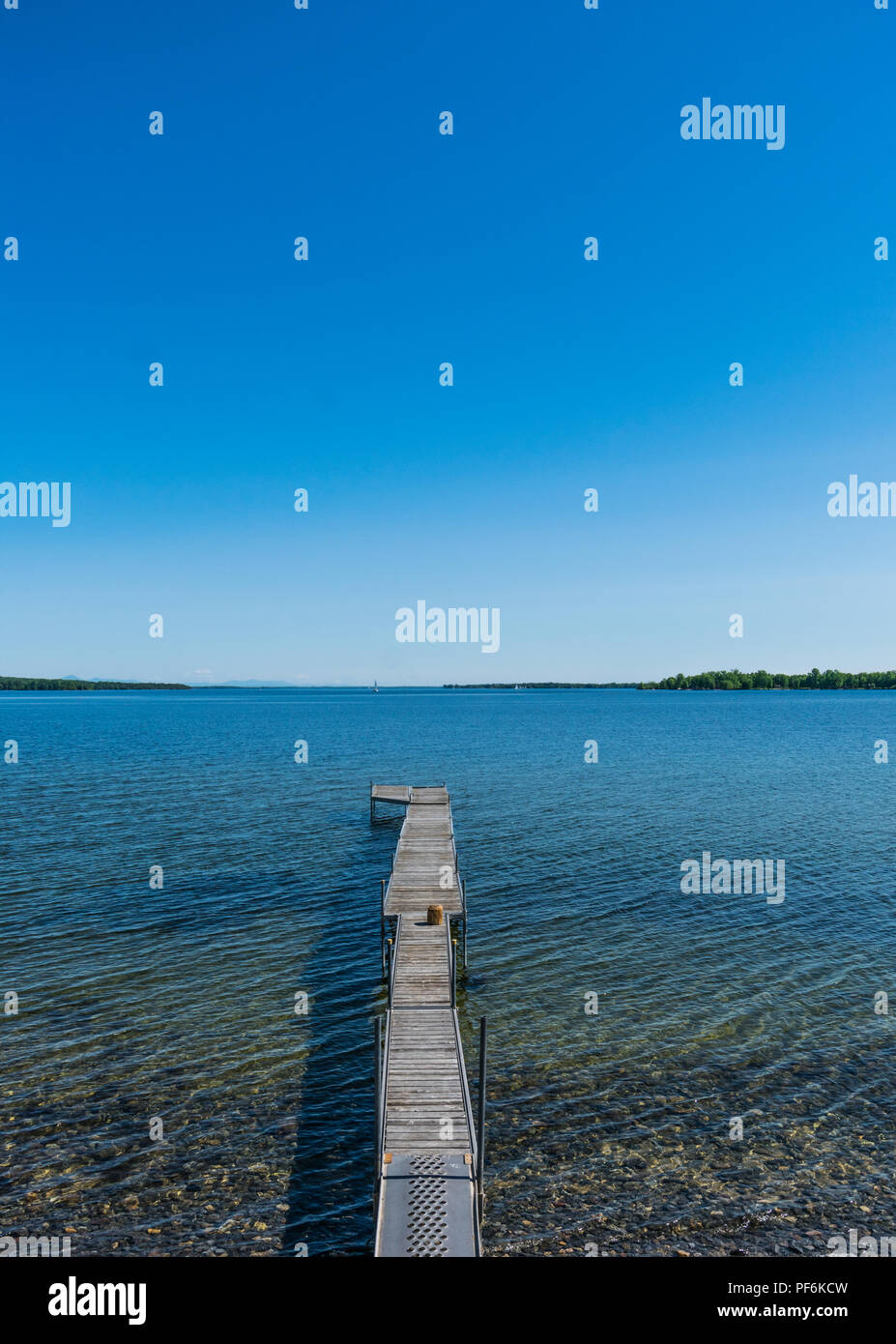 A boat dock extending out into beautiful Lake Champlain Stock Photo - Alamy