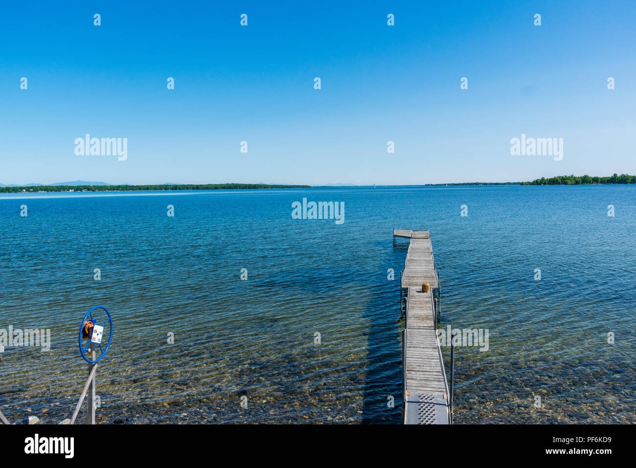 A boat dock extending out into beautiful Lake Champlain Stock Photo - Alamy