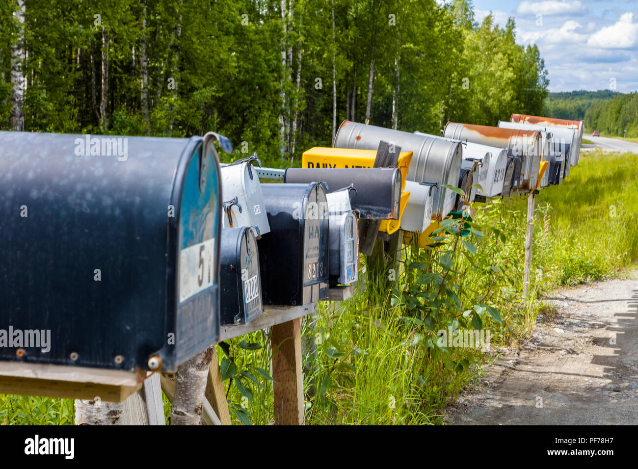Line of mailboxes along side road Stock Photo - Alamy