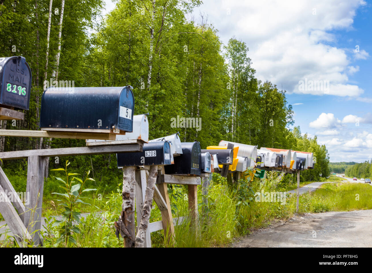 Line of mailboxes along side road Stock Photo - Alamy