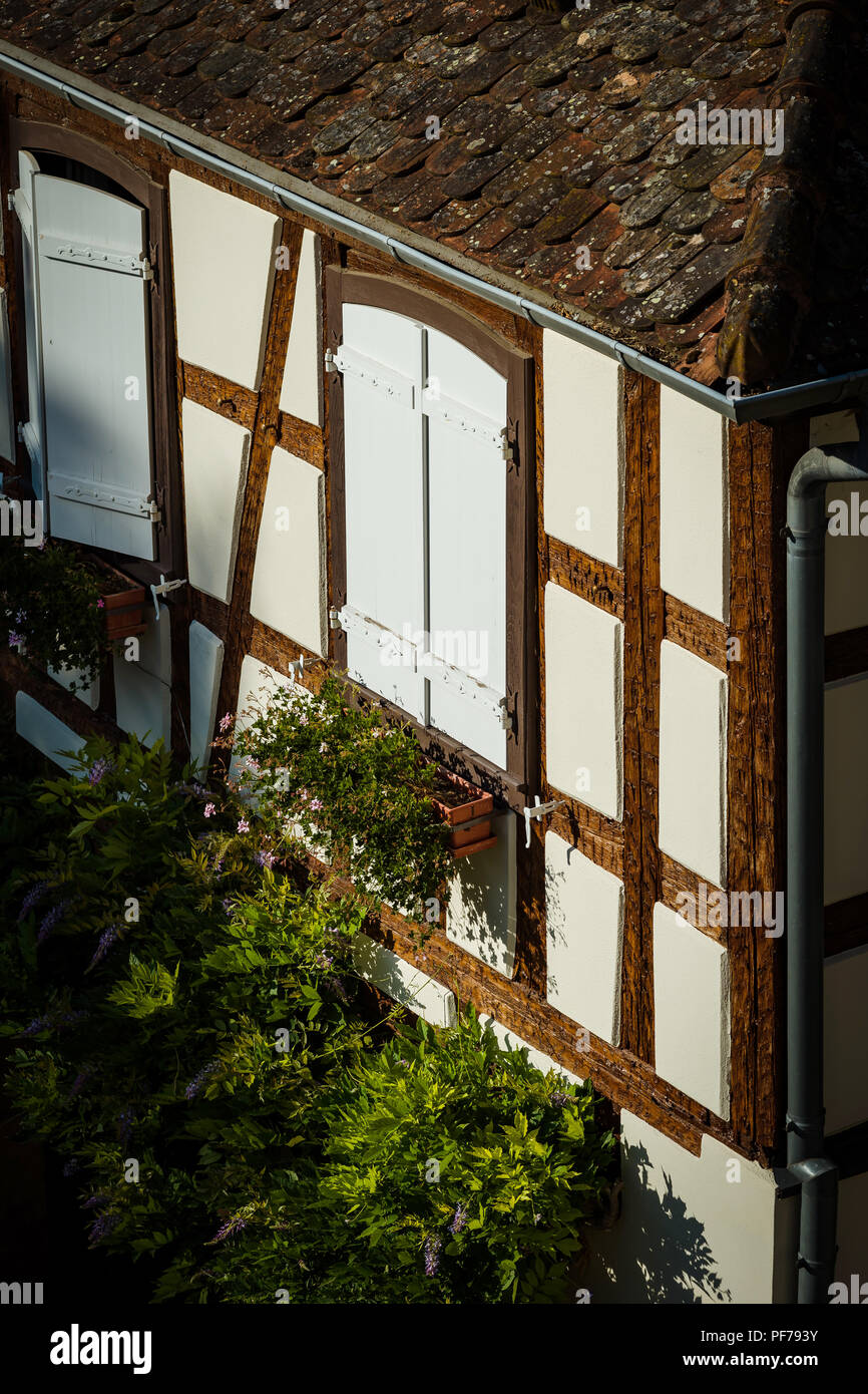 Classic old windows in timber-framing building, Alsace, sunny day Stock ...