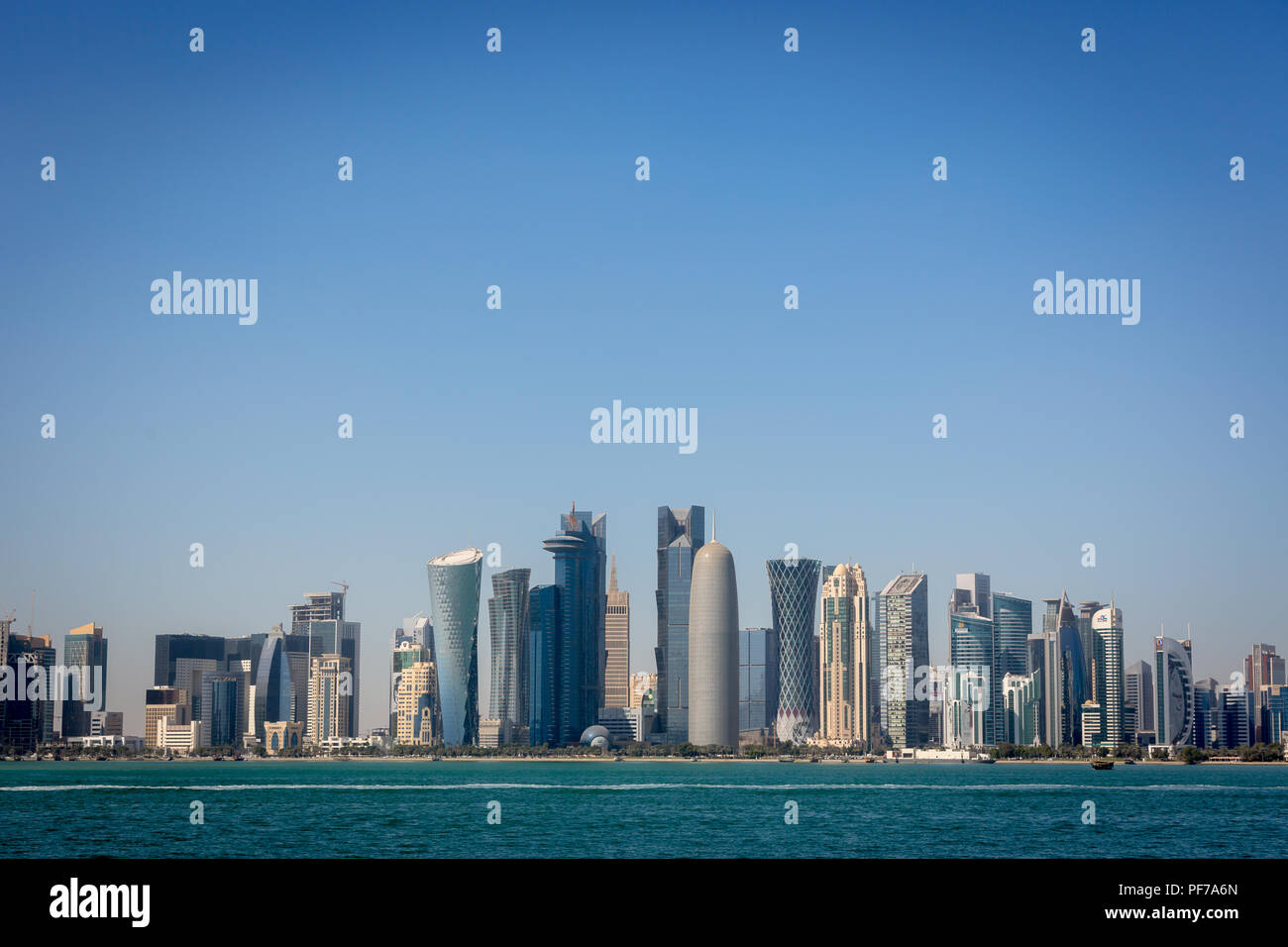 The skyline of Doha in a haze winter day in Qatar Stock Photo - Alamy