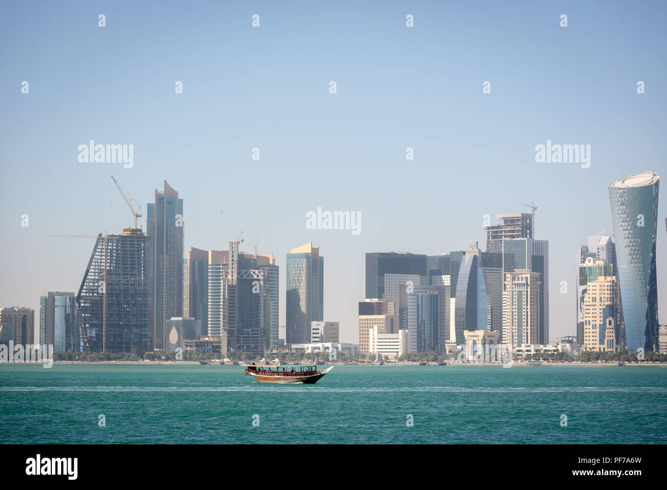 The skyline of Doha in a haze winter day in Qatar Stock Photo - Alamy