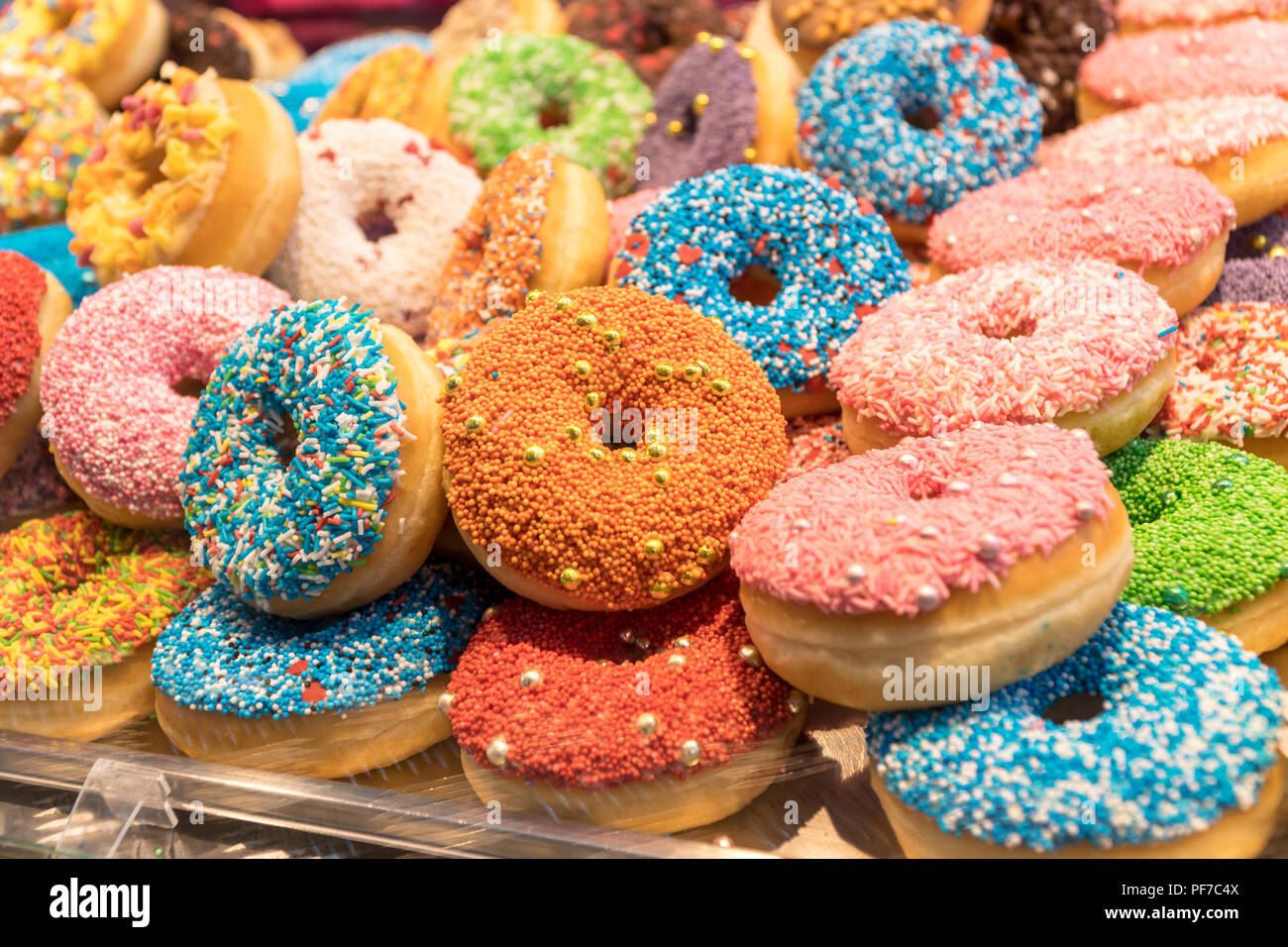 Many colorful assorted donuts Stock Photo - Alamy
