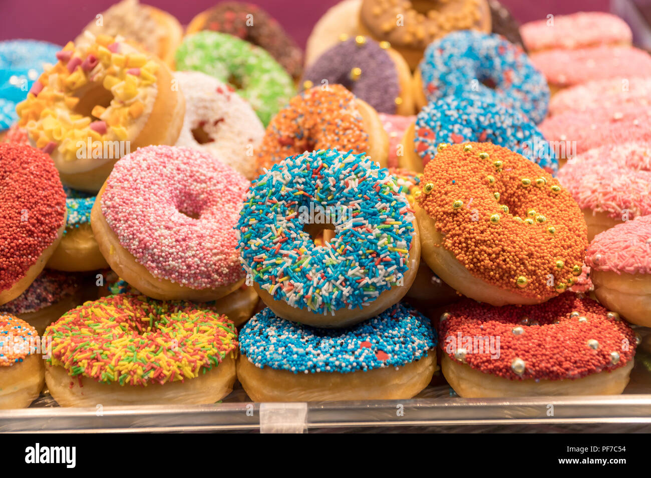 Many colorful assorted donuts Stock Photo - Alamy