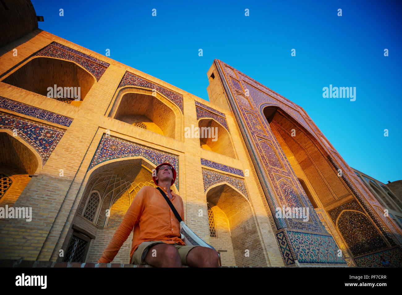 Tourist near ancient historic building in Uzbekistan Stock Photo - Alamy