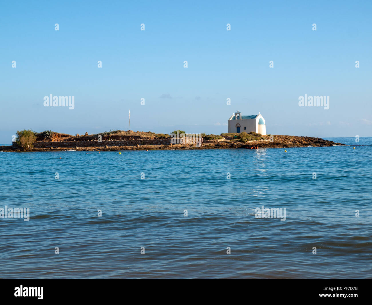 Picturesque small Chapel on island across Malia beach, Crete. Greece ...