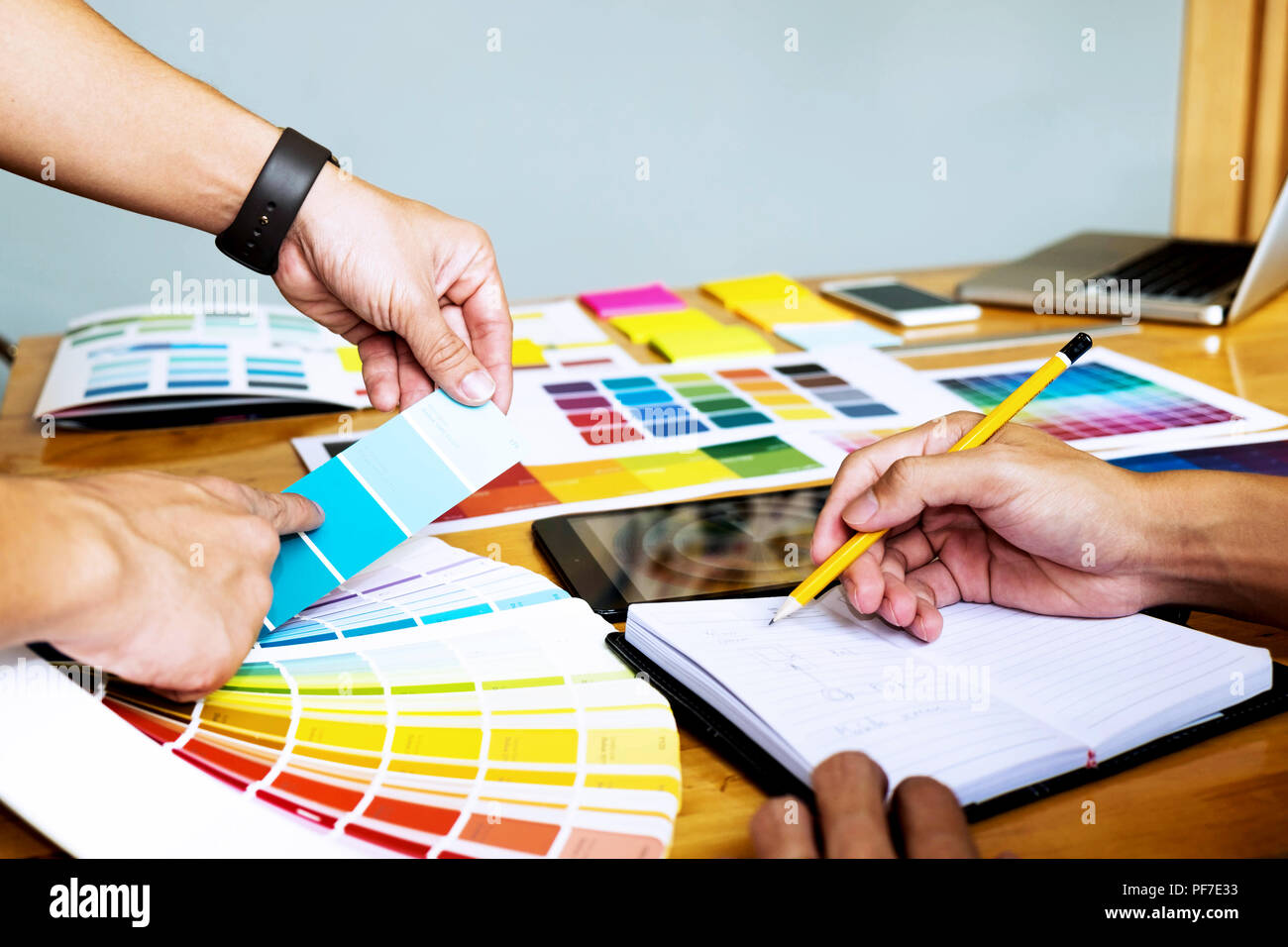 Graphic designers choose colors from the color bands samples for design ...