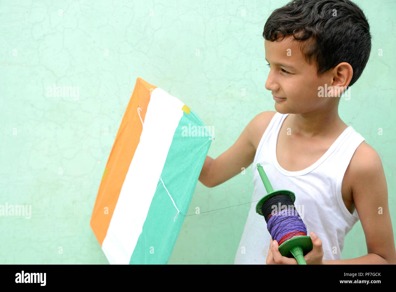 Child playing with kite Stock Photo - Alamy