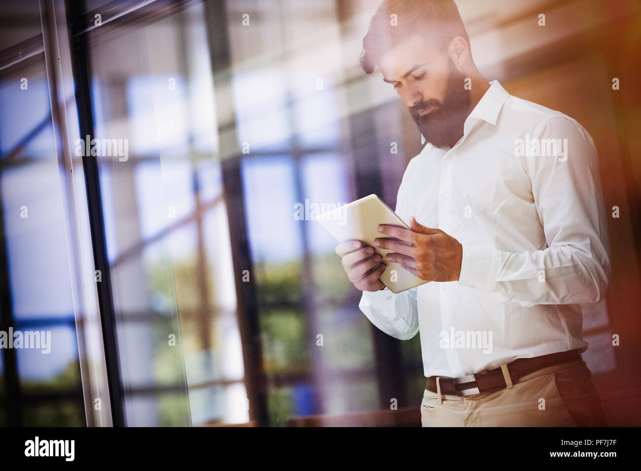 Businessman taking the elevator Stock Photo - Alamy