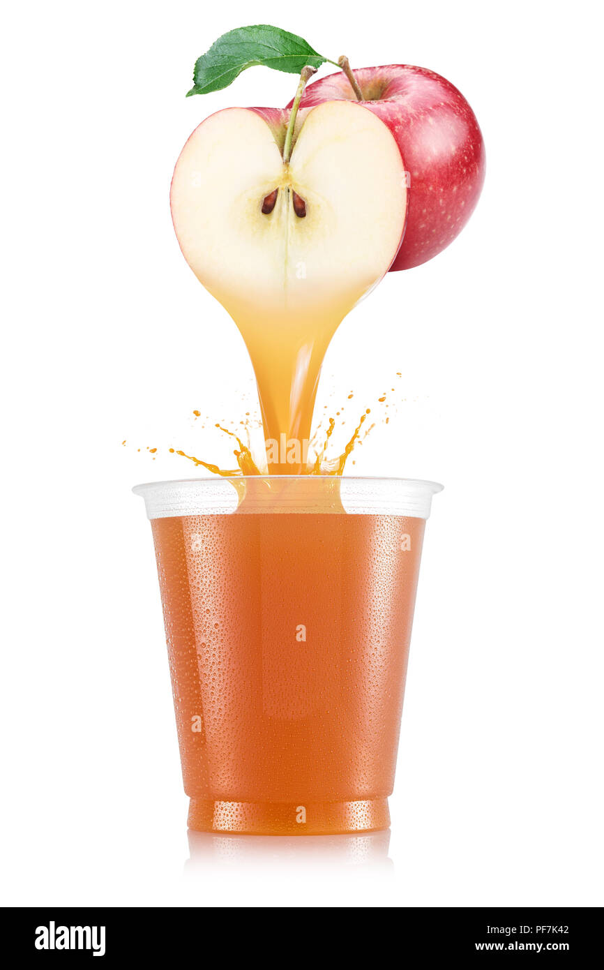 Pure apple juice pouring out from fruit into plastic cup isolated on ...