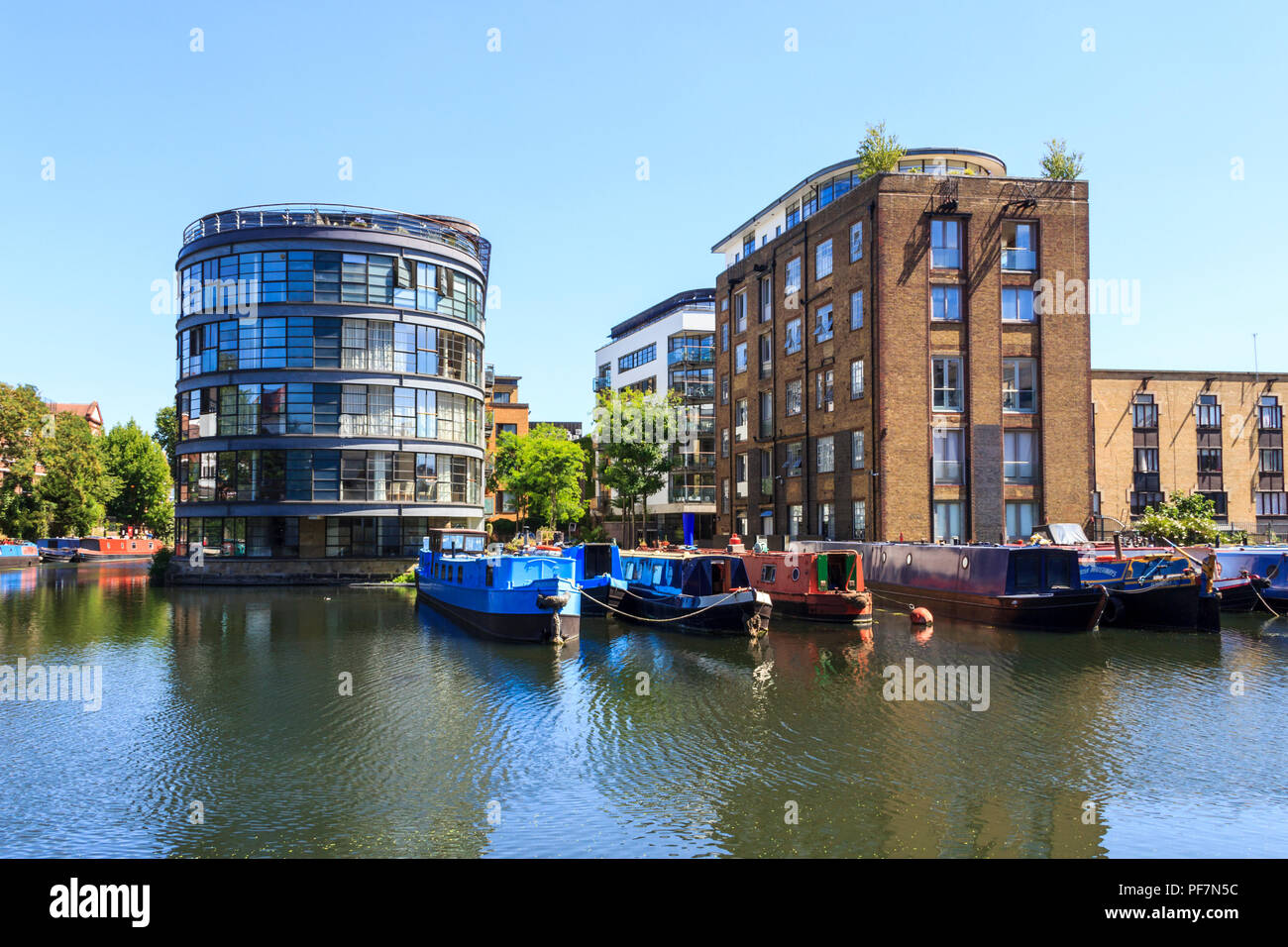 Narrowboats moored by Ice Wharf and Albert Dock in the Battlebridge Basin of Regent's Canal ...