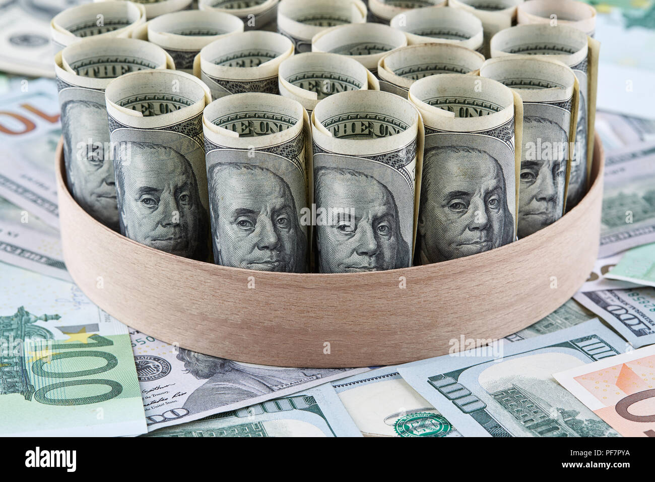 Rolls made of american dollars banknotes Stock Photo - Alamy
