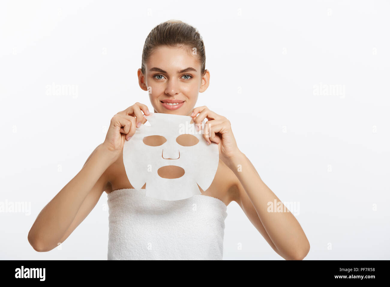 Beauty Skin Care Concept - Beautiful Caucasian Woman applying paper ...