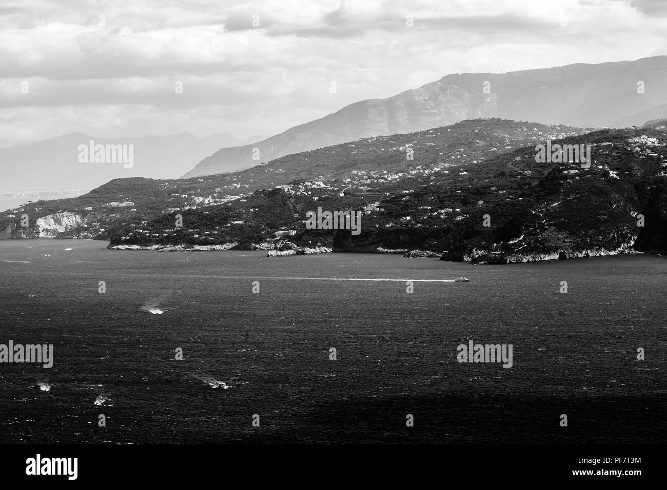 Beautiful aerial view of Capri island, with boat trails on the water ...