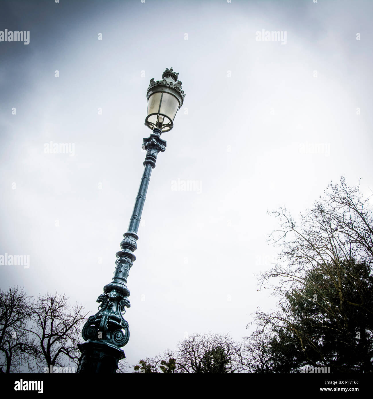 Lamppost in wrought iron and old fashioned, view from below Stock Photo ...
