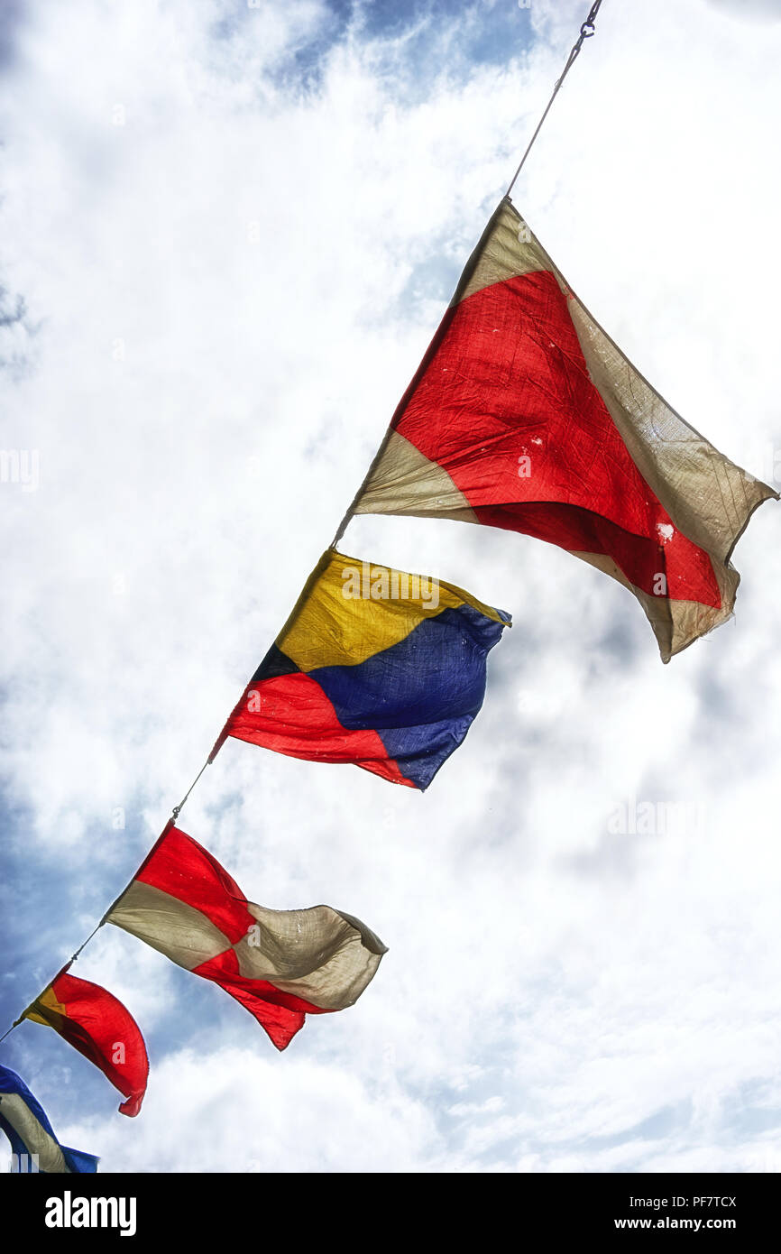 Marine flags on a rope on the sky background Stock Photo - Alamy