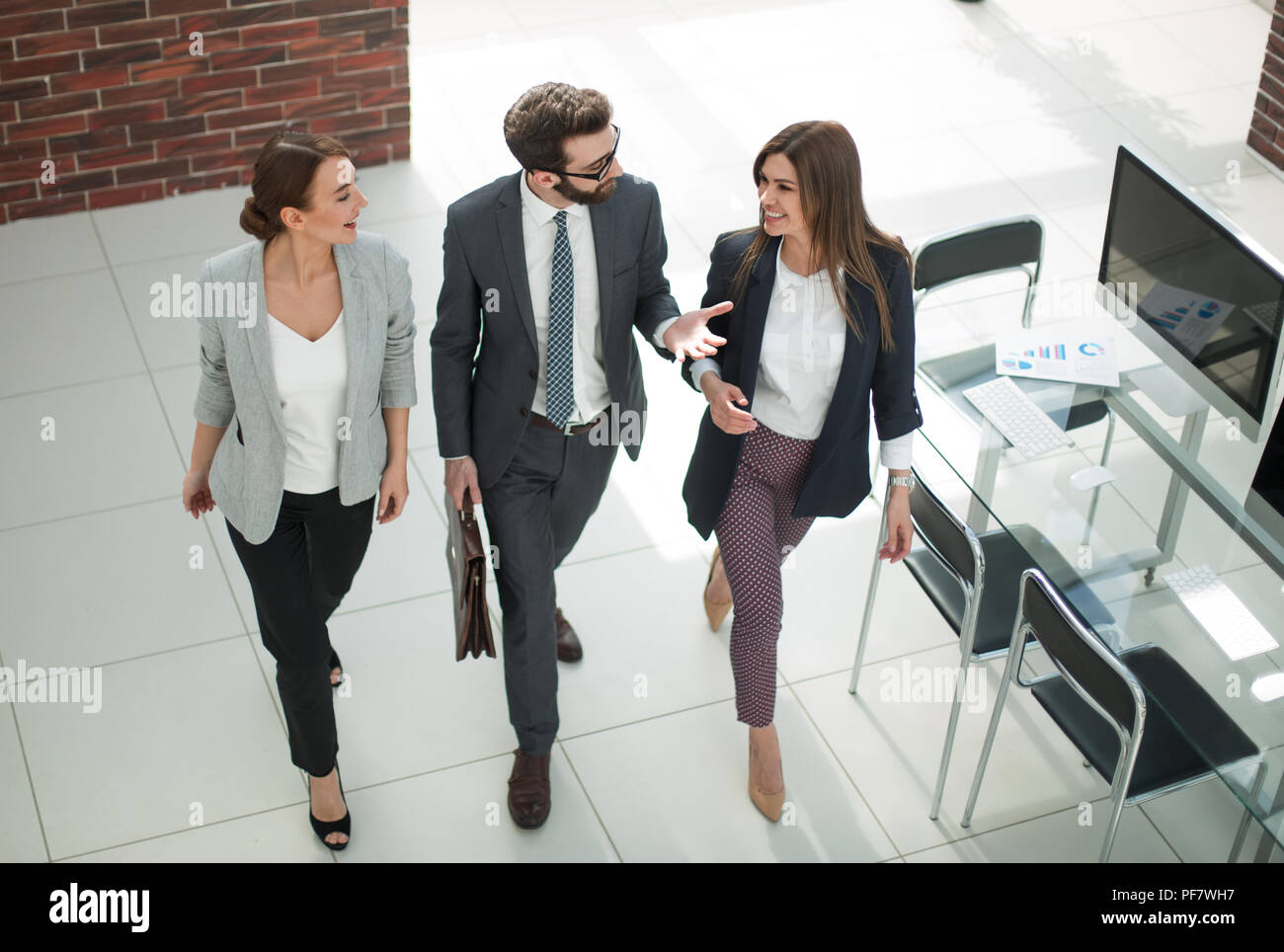 top view.three employees standing in the office Stock Photo - Alamy