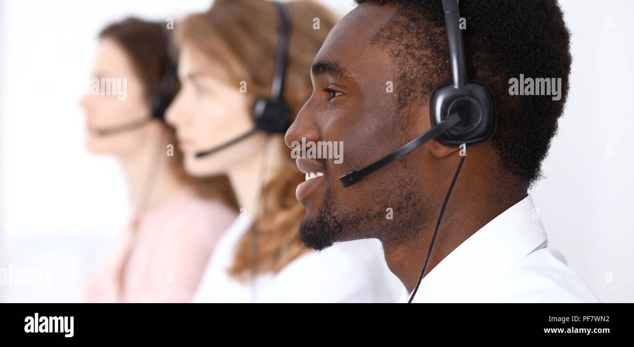 African american call operator in headset. Call center business or ...