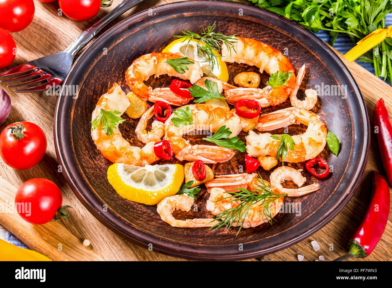 prawn tails, fried in olive oil with spices, close-up Stock Photo - Alamy