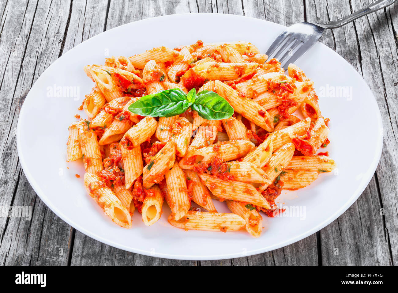 Italian Pasta Penne with Sun-Dried Tomato Pesto, close-up Stock Photo ...
