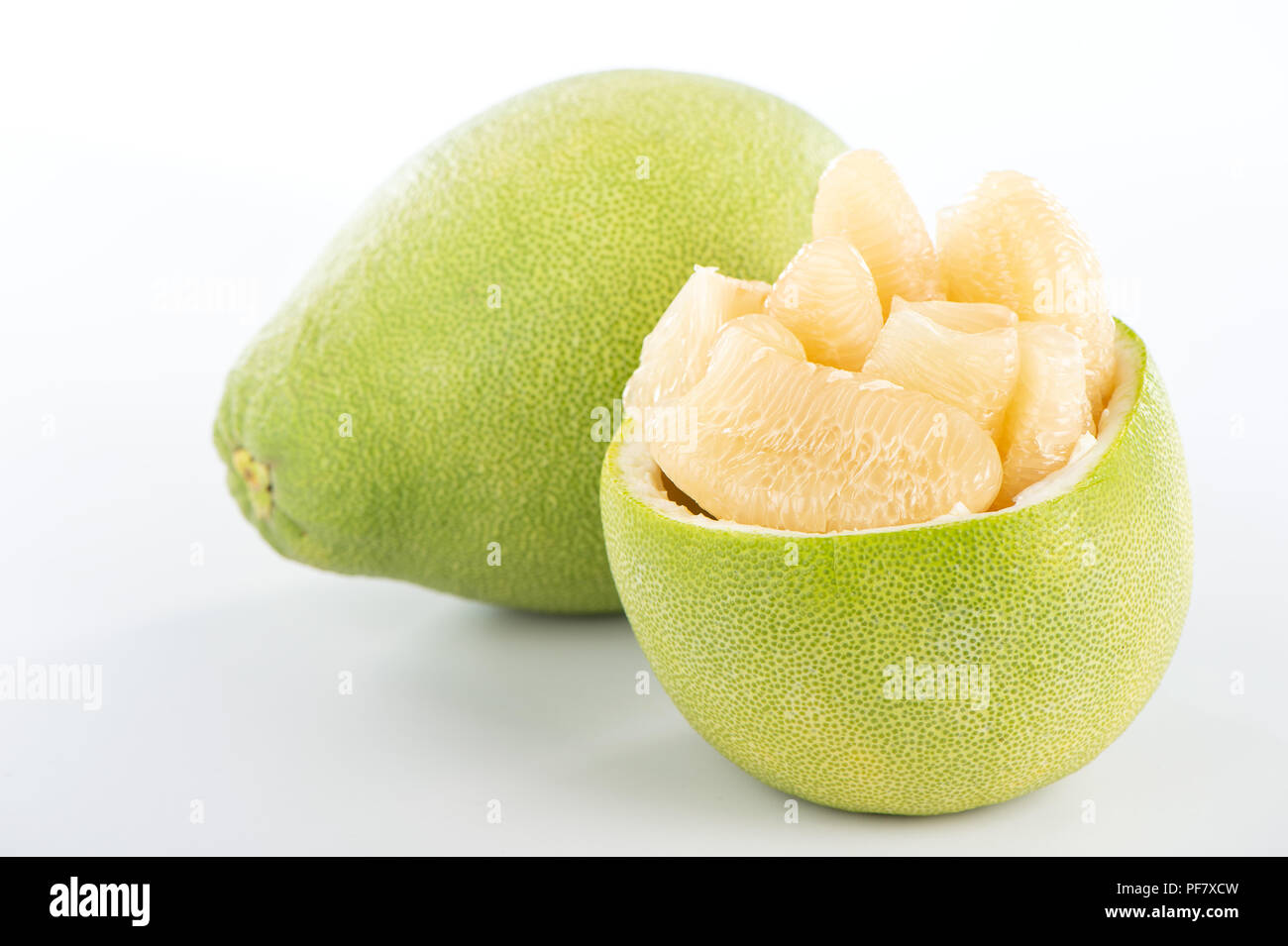 fresh and peeled pomelo(shaddock), grapefruit with slices isolated on ...