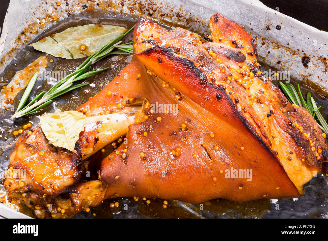 roast pork knuckle with rosemary, pepper, garlic, mustard and spices ...