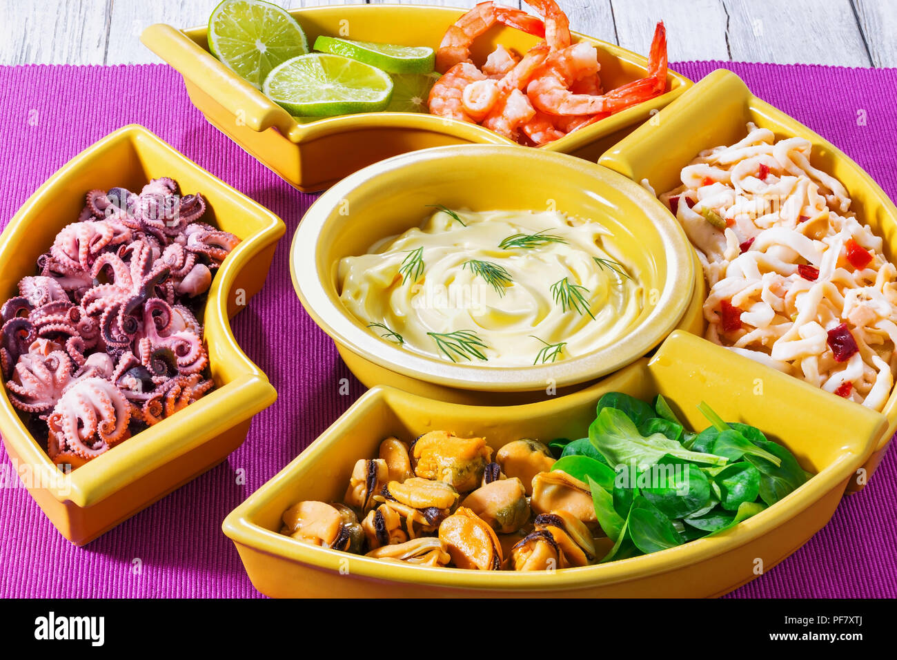 seafood set of prawns, octopus, mussels, squid rings with lime Stock ...
