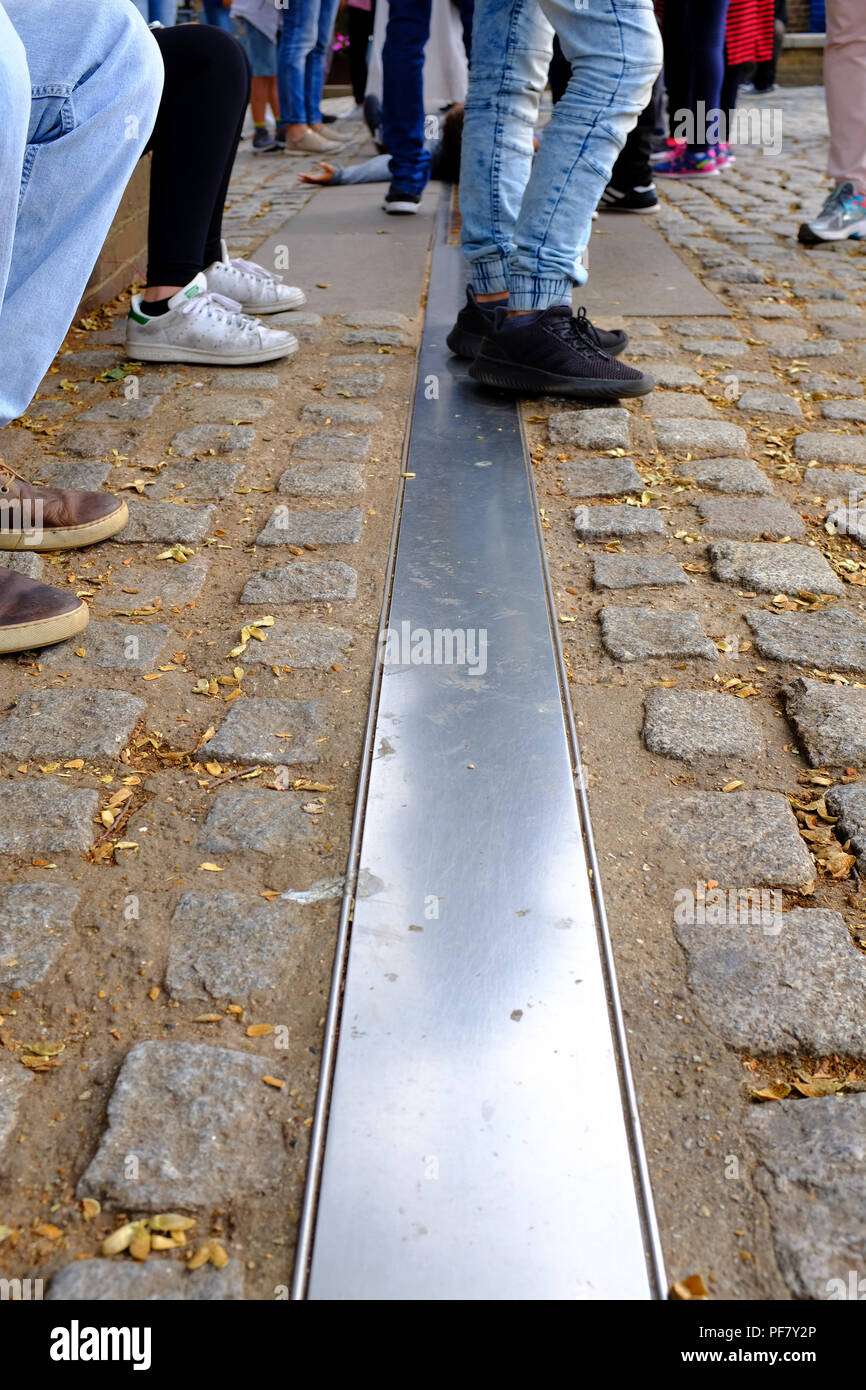 Tourists taking photos and selfies of the Meridian line at The Royal ...