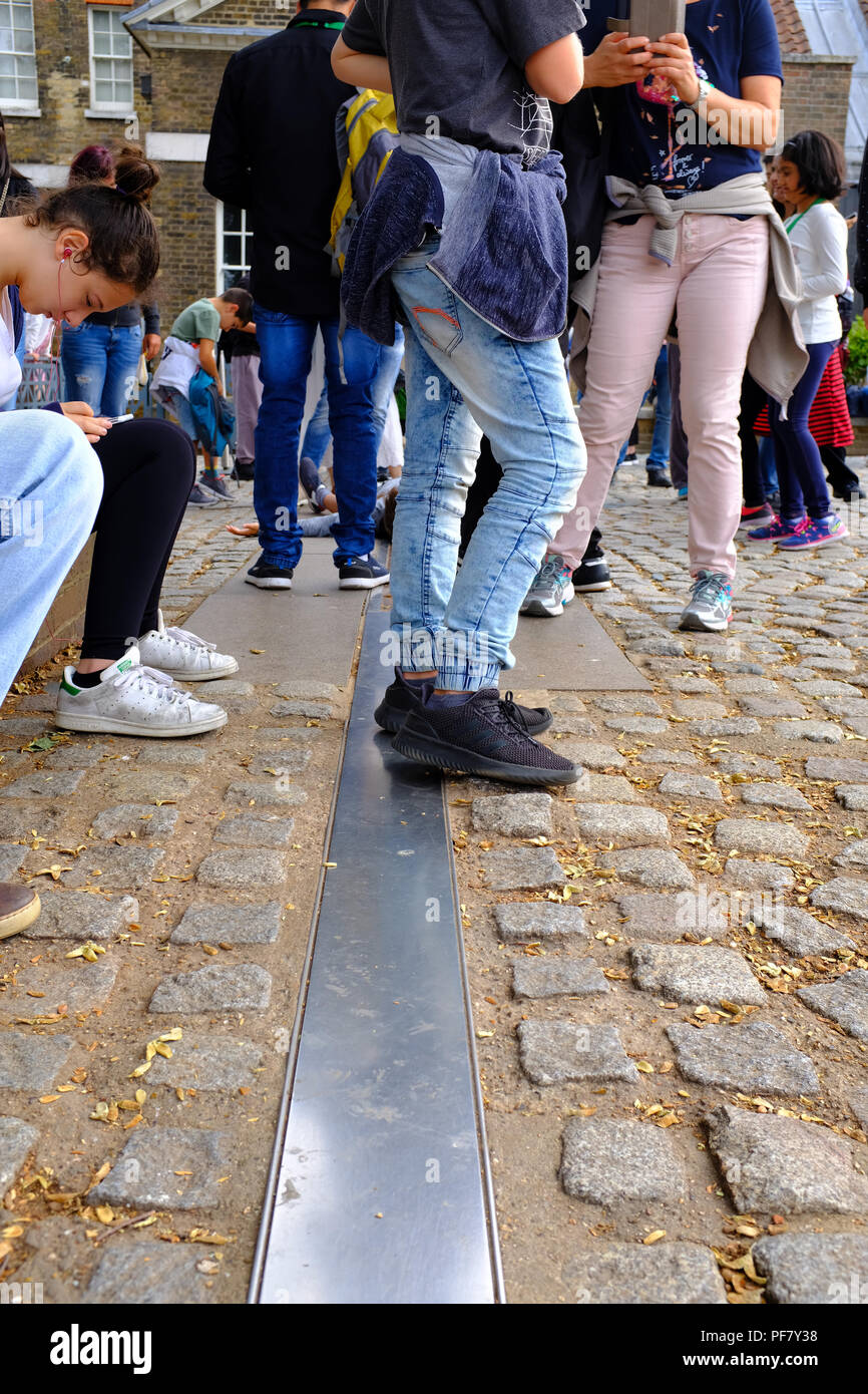 Tourists taking photos and selfies of the Meridian line at The Royal ...