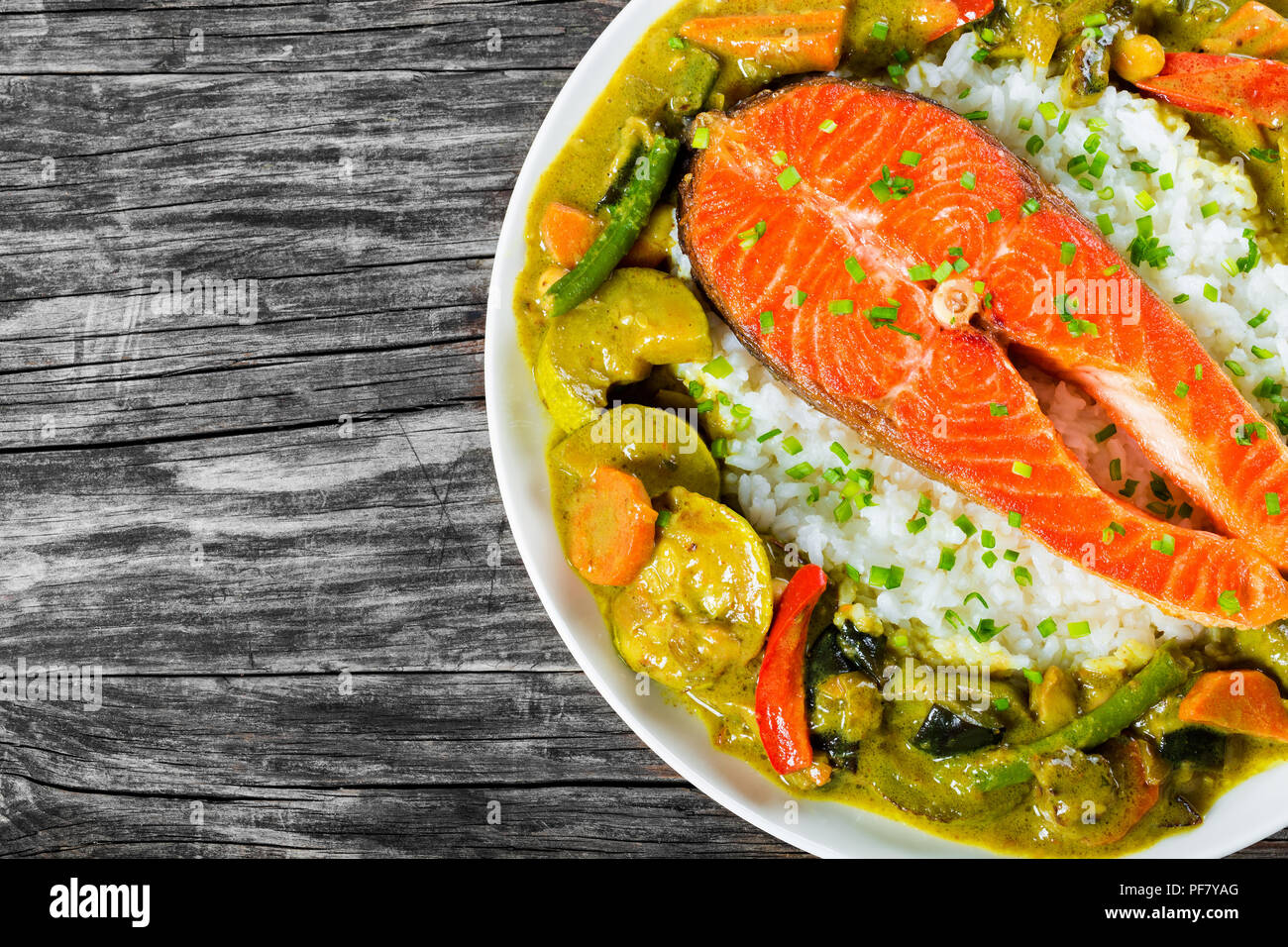 fried steak of red fish with rice and homemade curry Stock Photo - Alamy