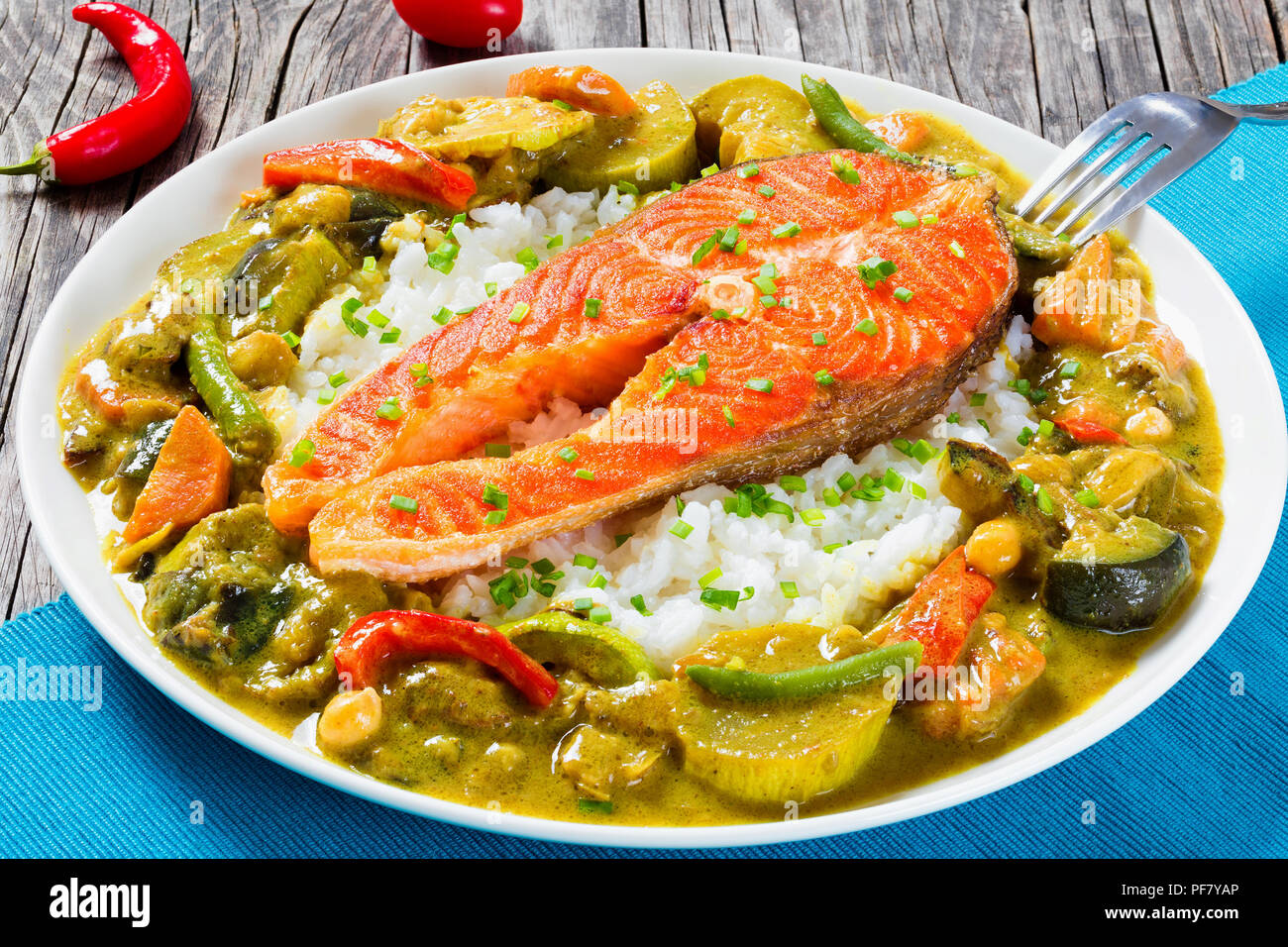 fried steak of red fish with rice and homemade curry Stock Photo - Alamy
