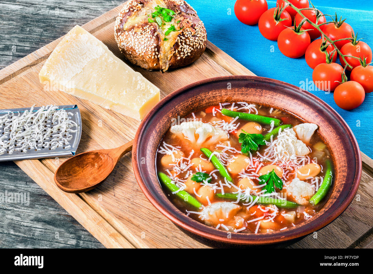 Minestrone vegetable soup with beans, cauliflower, tomatoes, close-up ...