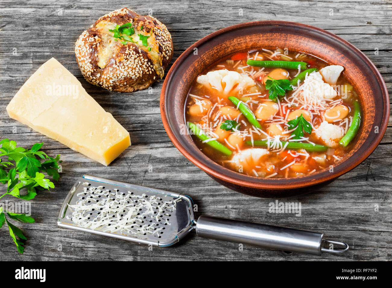 Minestrone vegetable soup with beans, cauliflower, tomatoes, close-up ...
