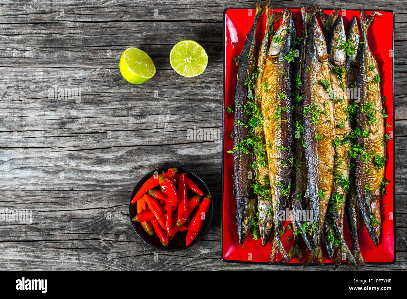 Baked saury on a red rectangular dish , close-up top view Stock Photo ...
