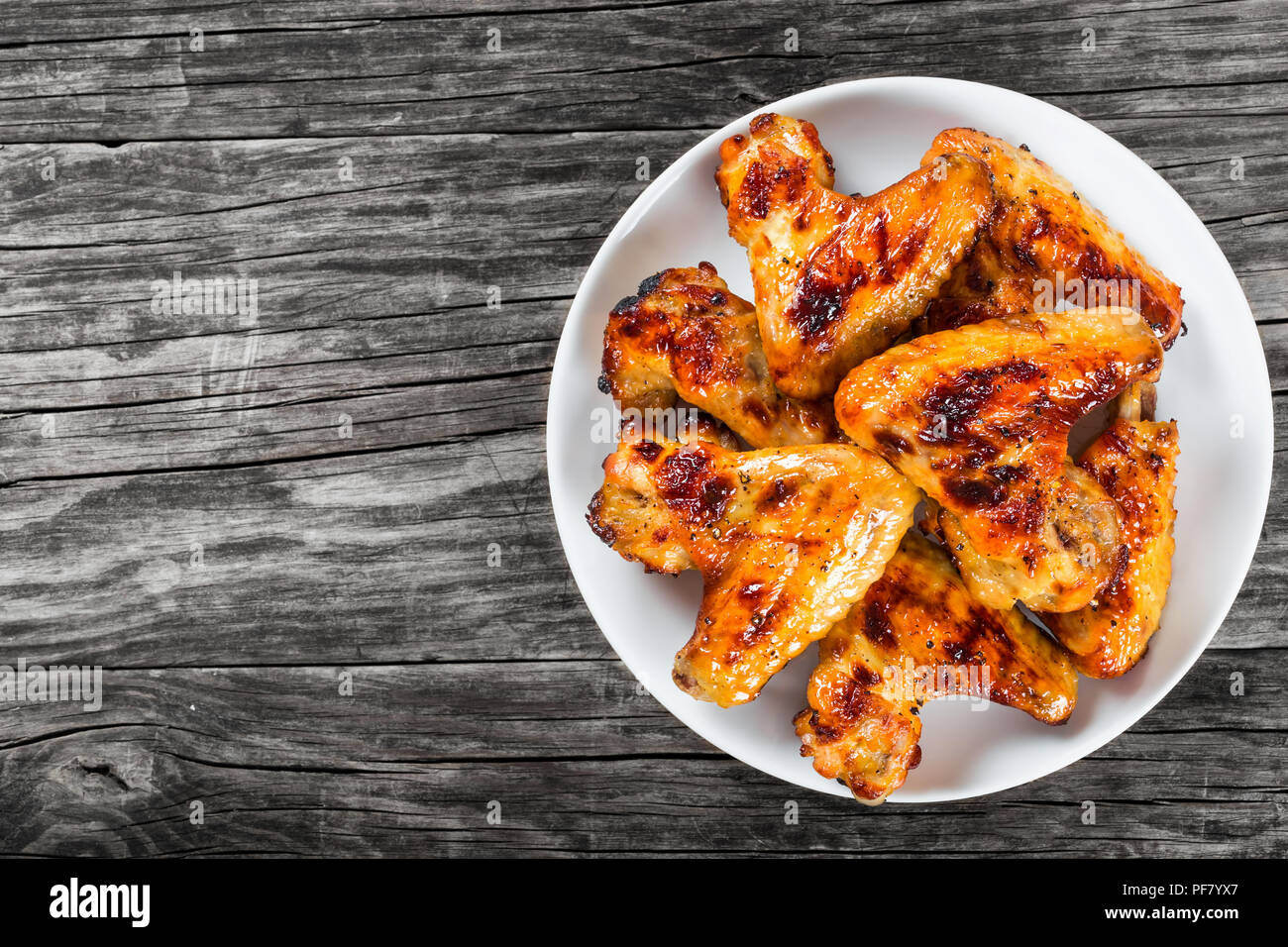 roasted chicken wings with spices, top view, close-up Stock Photo - Alamy