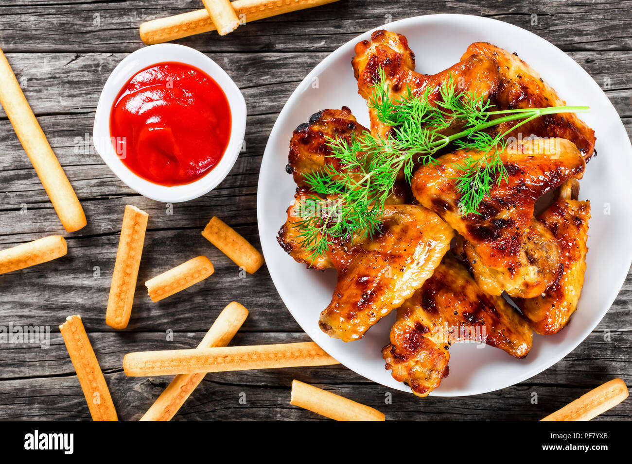 roasted chicken wings with spices, top view, close-up Stock Photo - Alamy