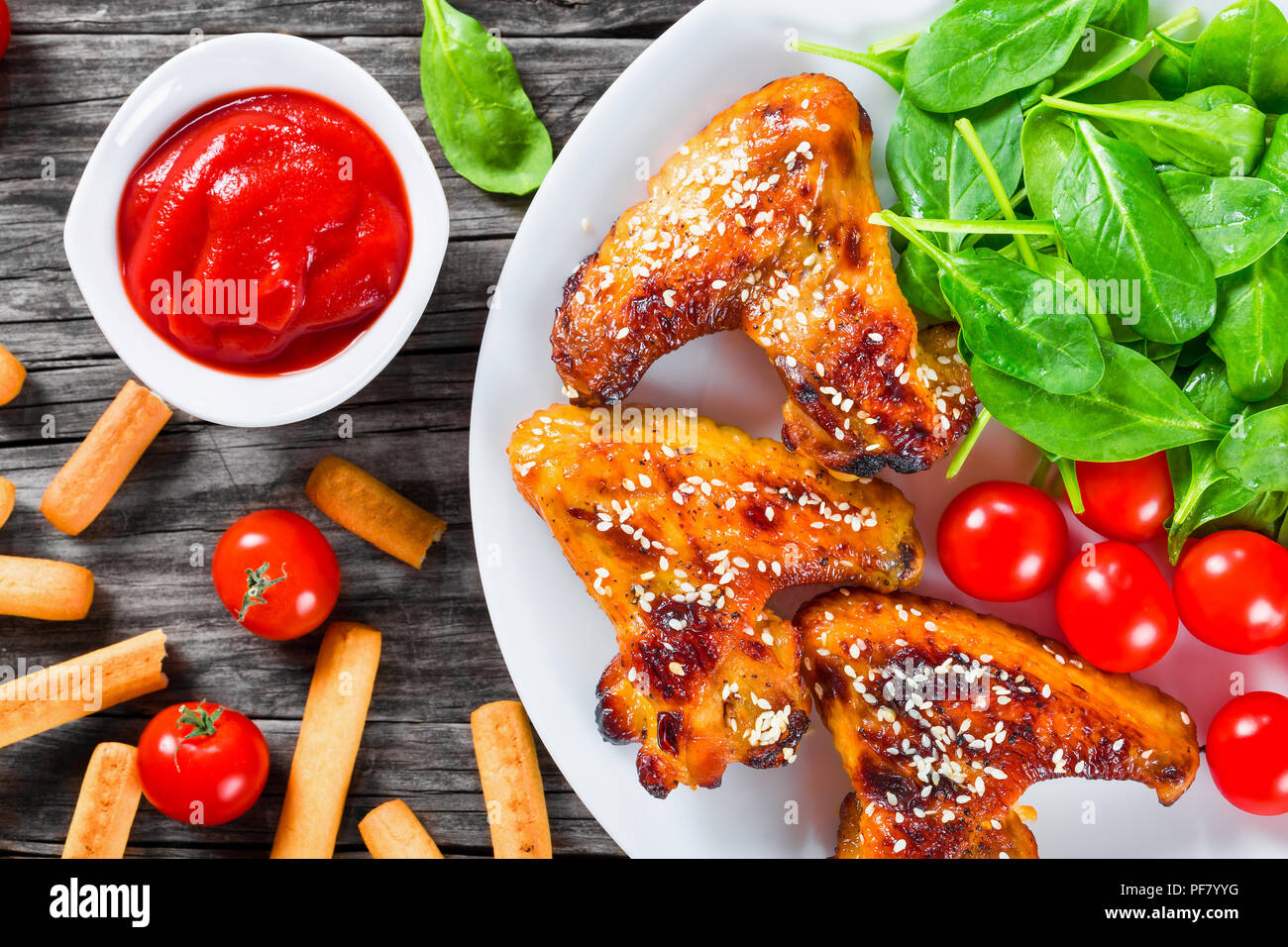 roasted chicken wings with spices, top view, close-up Stock Photo - Alamy