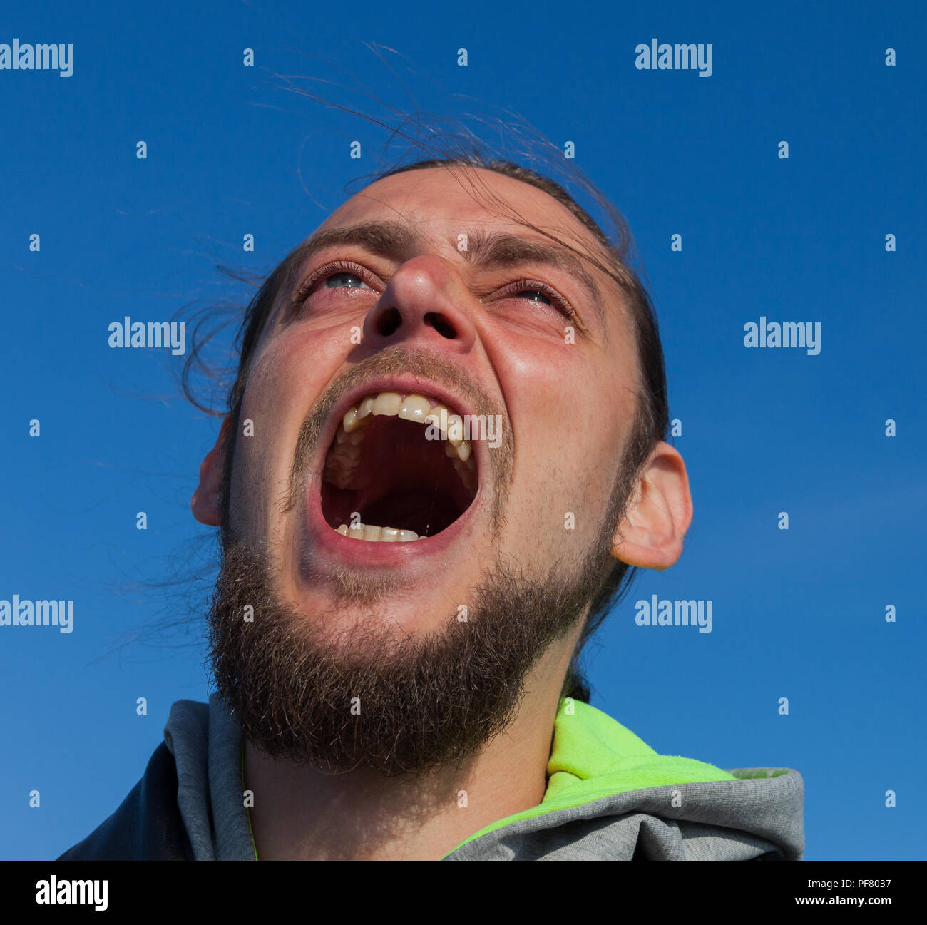 Young man is screaming help Stock Photo - Alamy