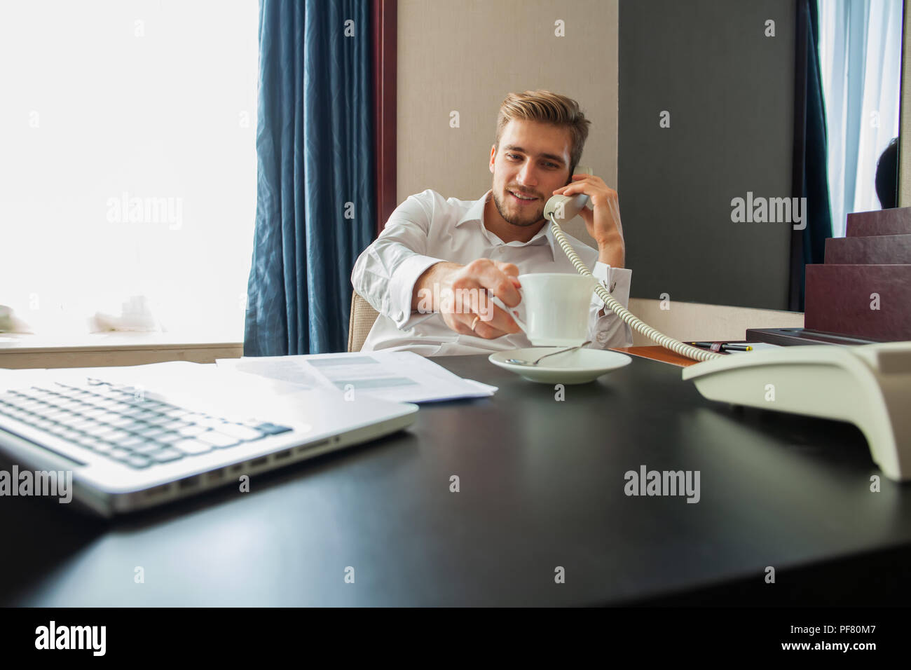 Businessman smiling in luxury armchair hi-res stock photography and ...