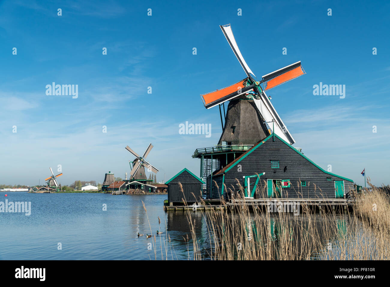 Beauty windmills over a lake in Netherlands Stock Photo - Alamy