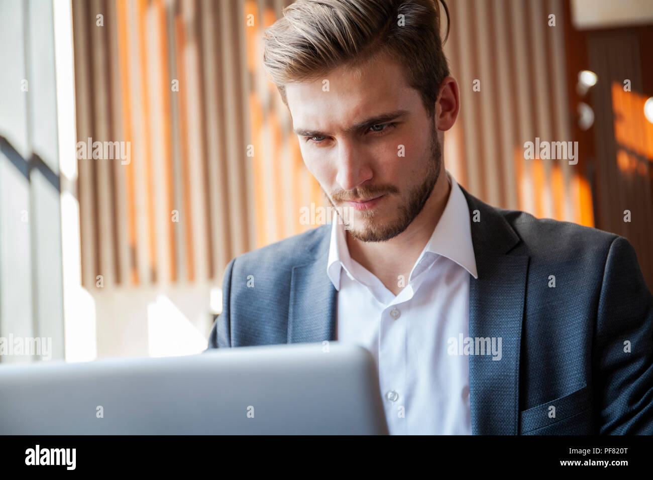 Young businessman waiting someone in hi-res stock photography and ...