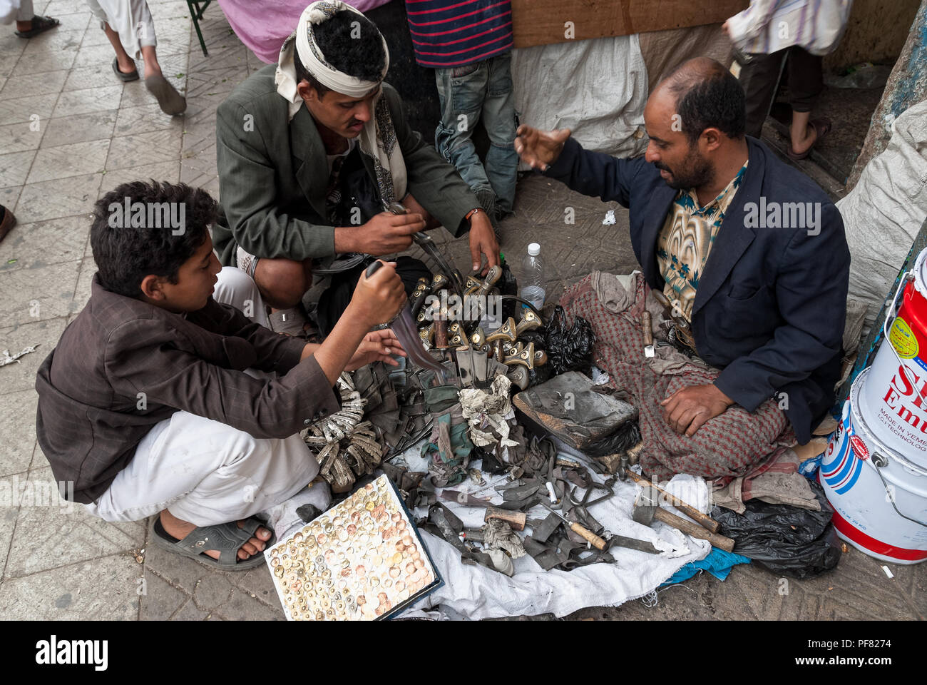 A man sells janbiyas on May 4, 2007 in Sanaa, Yemen. Janbiya is a ...