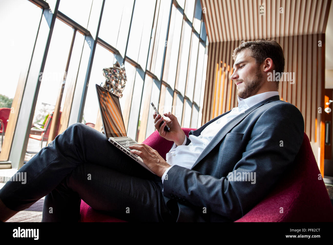 Business man waiting lobby sofa hi-res stock photography and images - Alamy