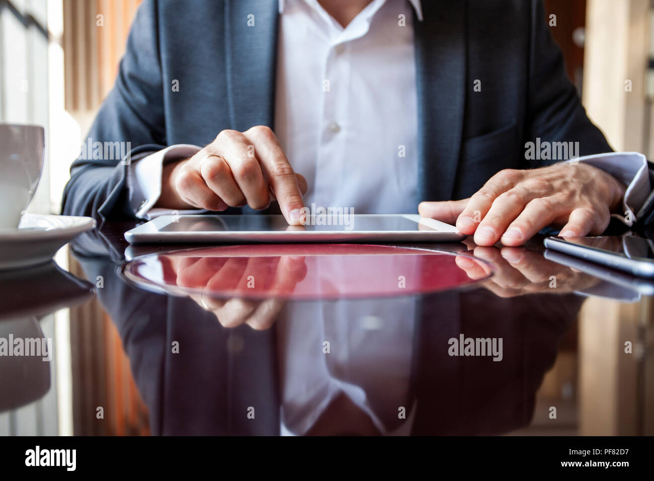 Businessman holding digital tablet, hands multitasking man using tablet ...
