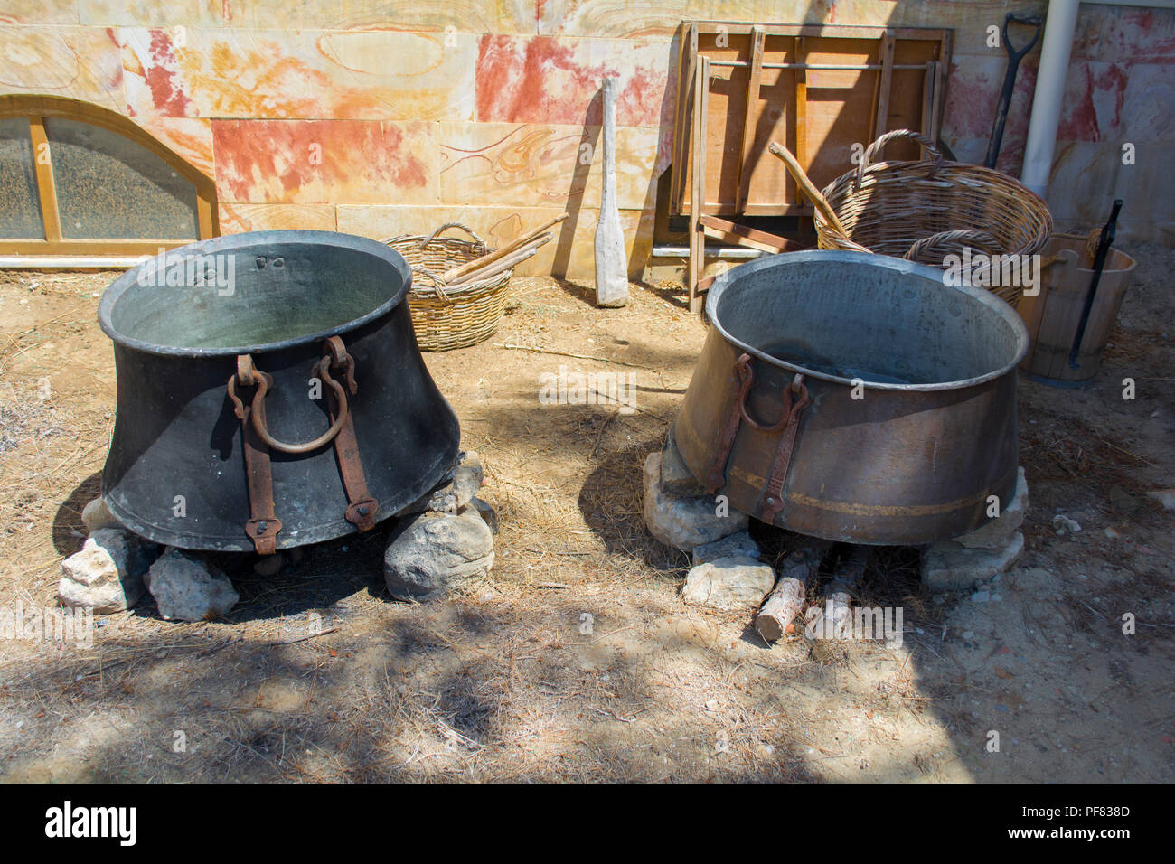 Food in a cauldron on a fire. Cooking outdoors in cast-iron cauldron ...