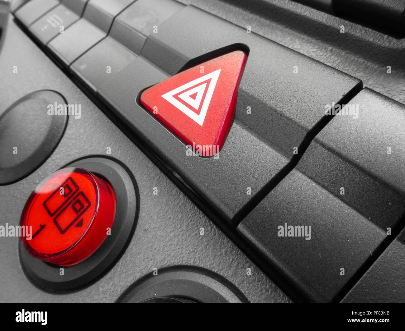 Focus over a red emergency triangle button inside a bus Stock Photo - Alamy