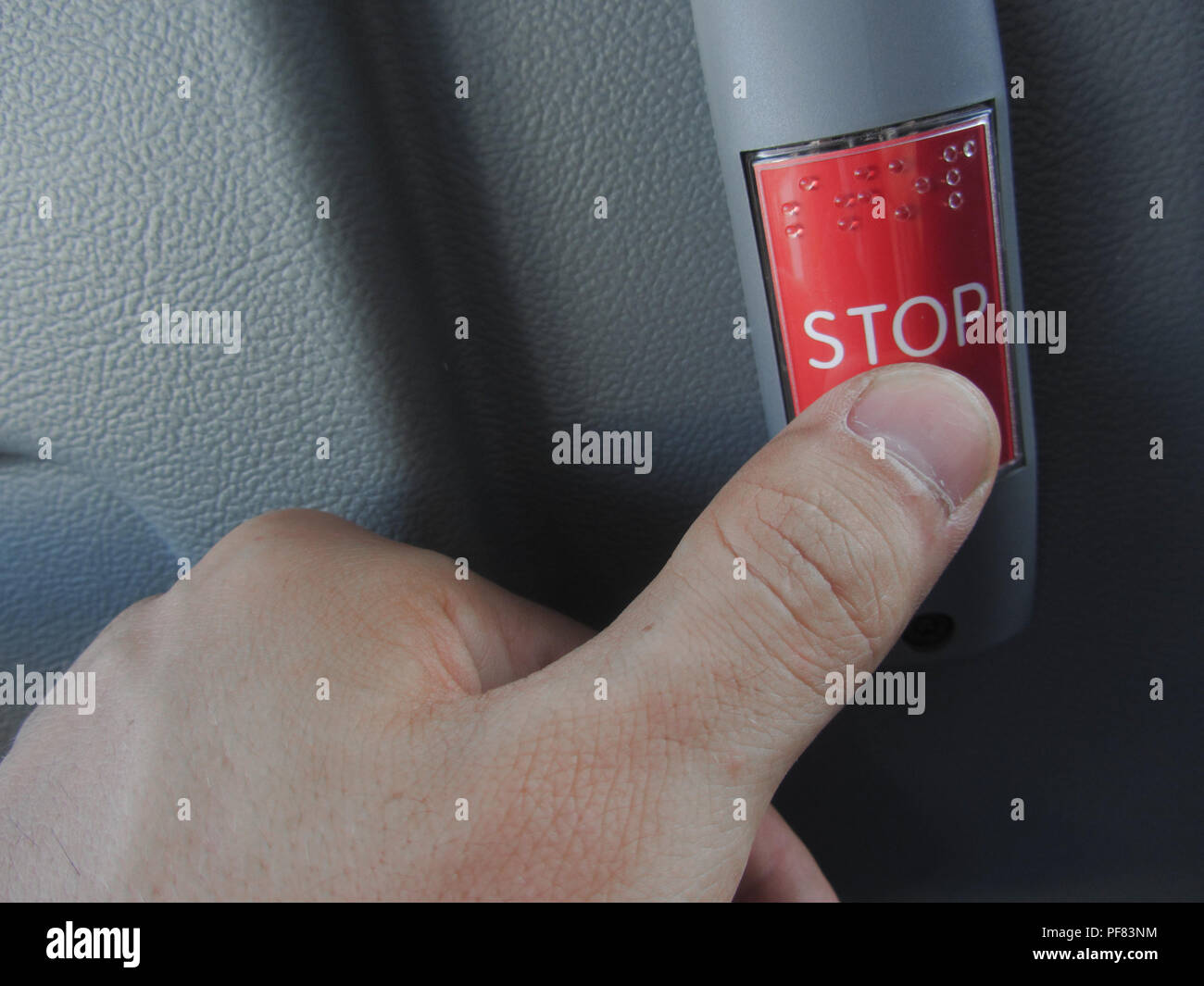 A red bus stop request button Stock Photo - Alamy
